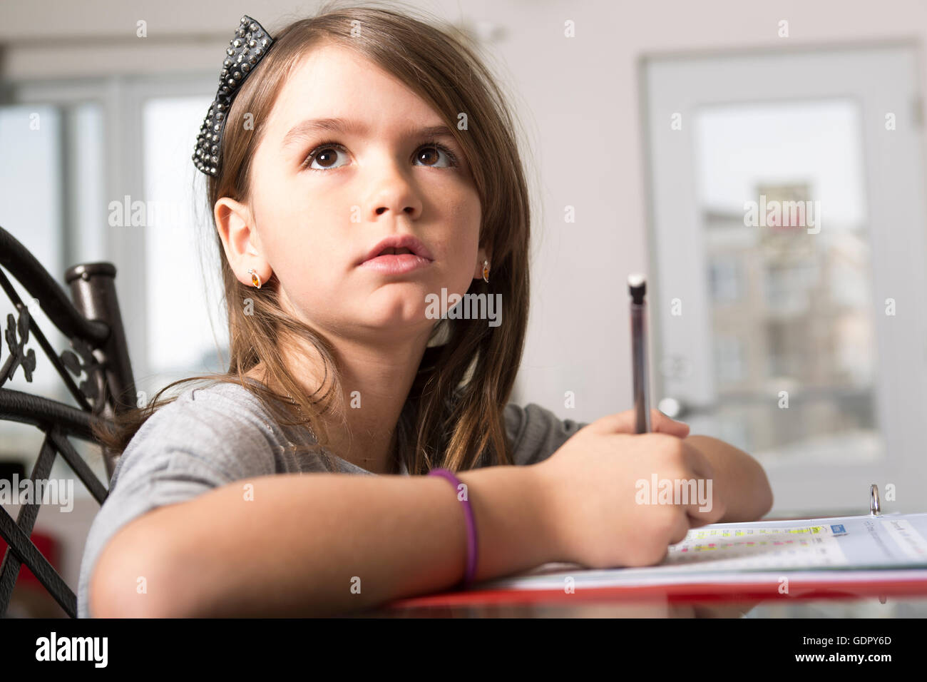 Teenage girl doing homework for school Stock Photo - Alamy