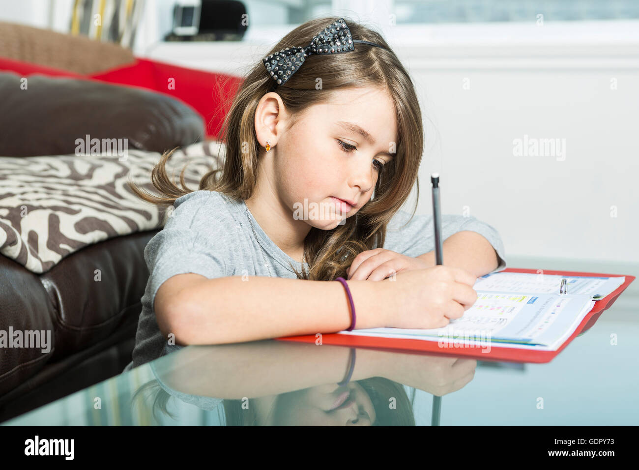 Teenage girl doing homework for school Stock Photo - Alamy