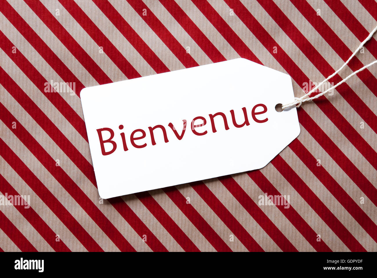 Label On Red Wrapping Paper, Bienvenue Means Welcome Stock Photo - Alamy