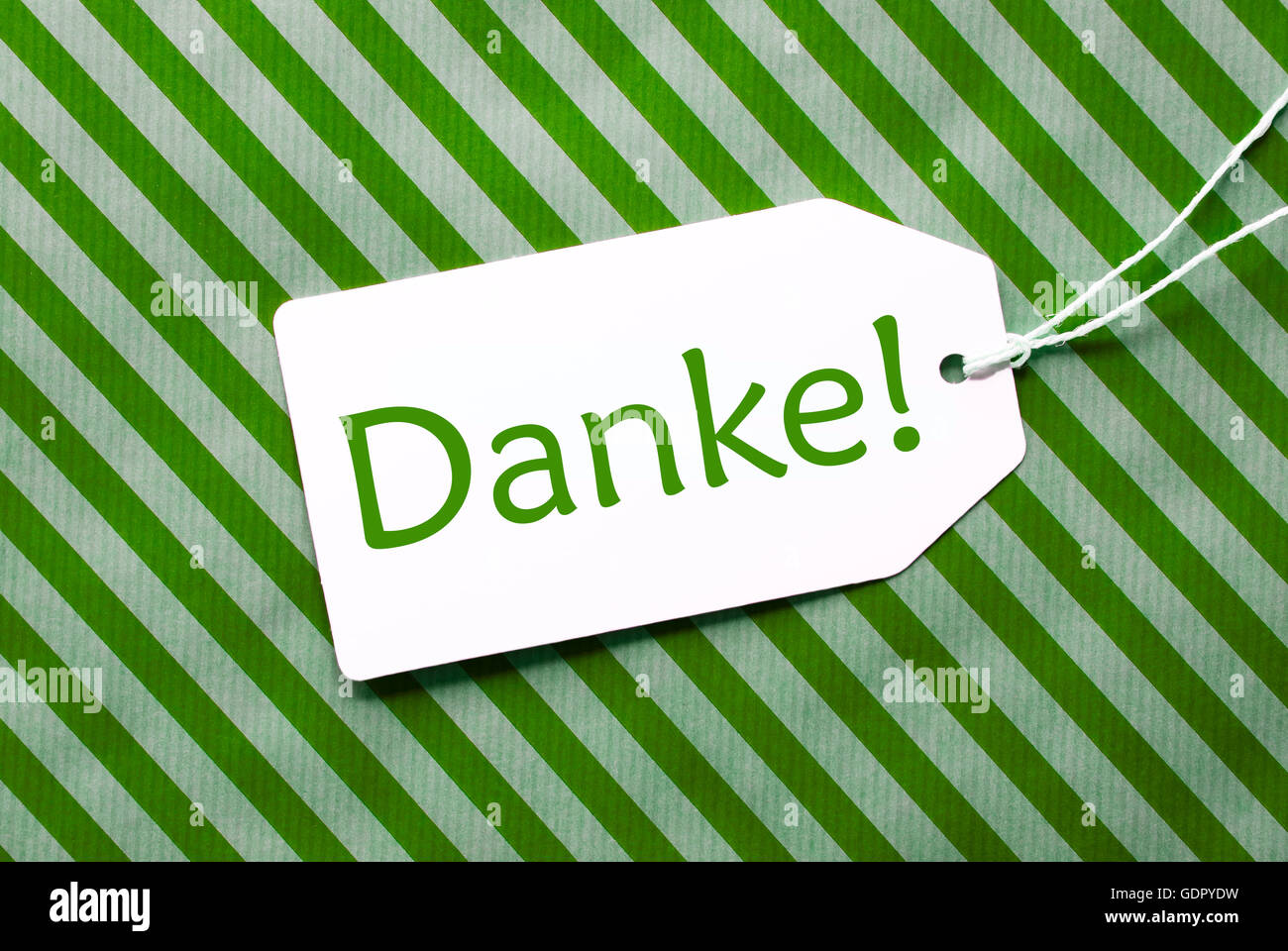 Label On Green Wrapping Paper, Danke Means Thank You Stock Photo - Alamy