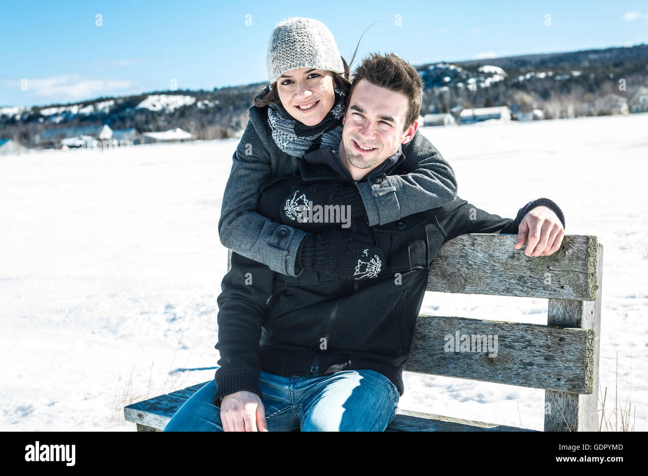 Couple In winter Snow Scene at beautiful sunny day Stock Photo - Alamy