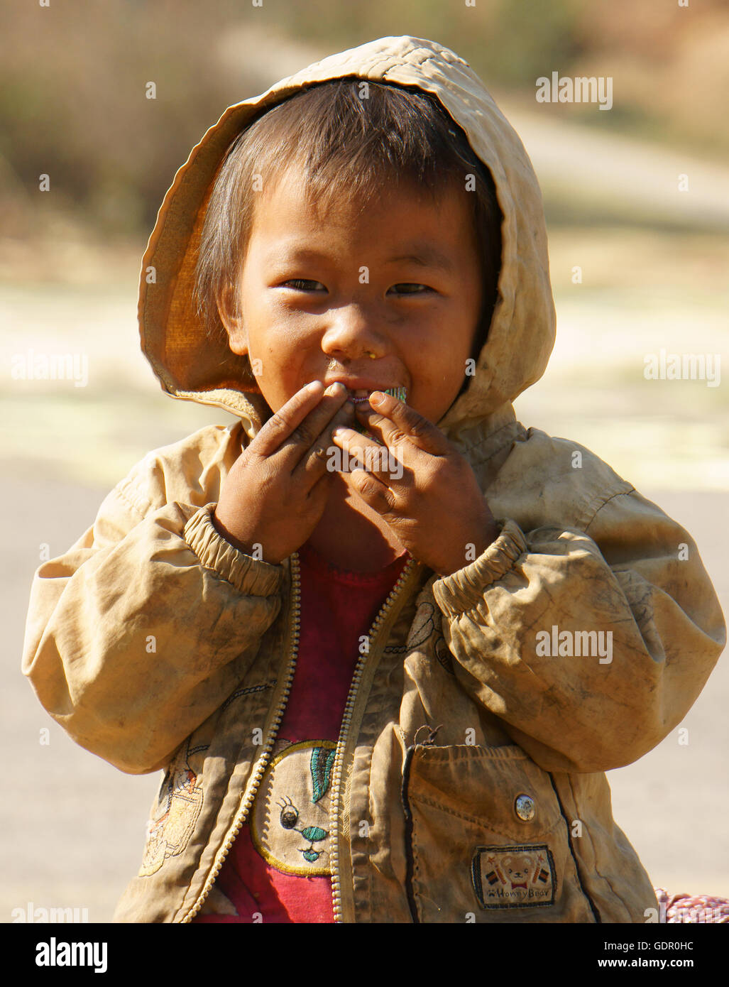 Asian children hungry and eating, dirty clothing, barefoot, poverty ...