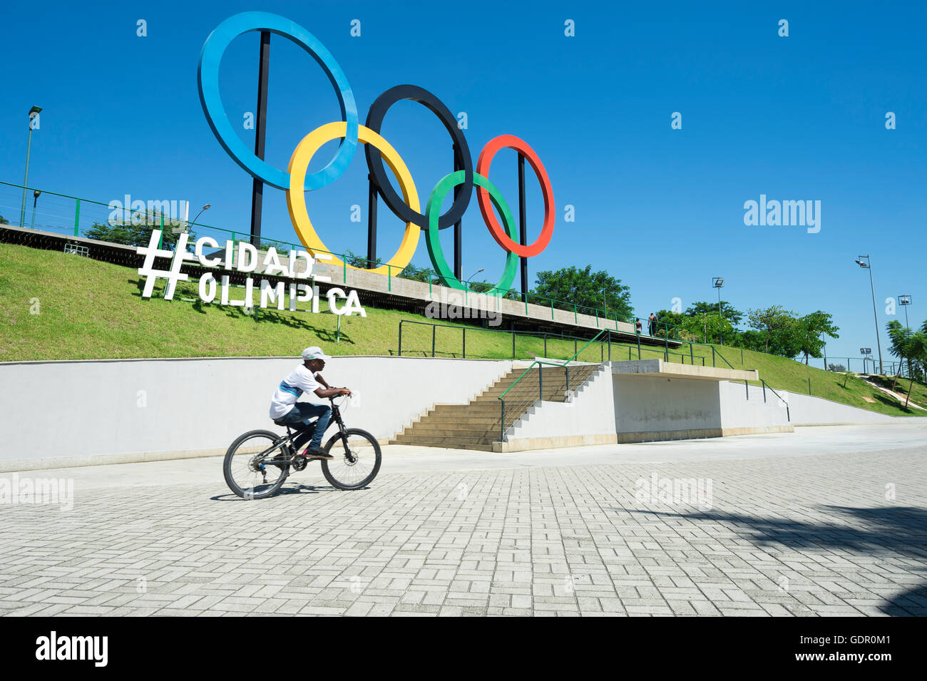 RIO DE JANEIRO - MARCH 18, 2016: A Brazilian man rides a bicycle in ...