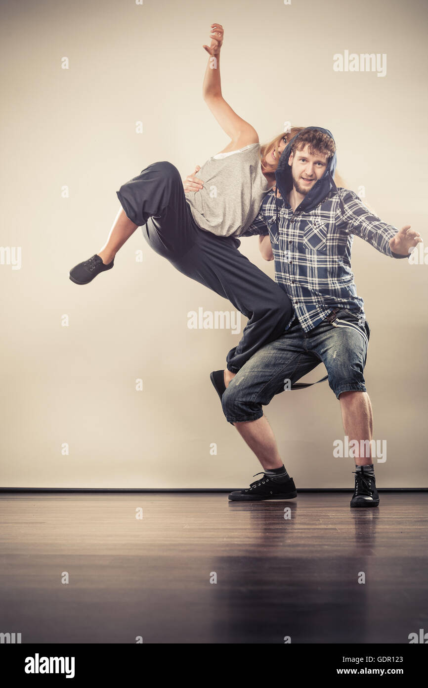 Two modern dancers couple woman and man dancing. Urban lifestyle. Hip ...