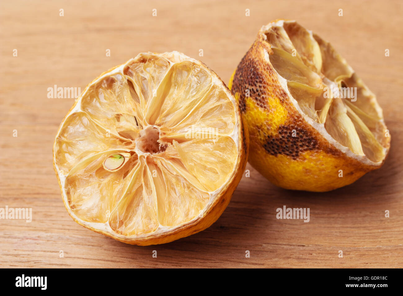 Closeup old rotten piece of lemon. Bad unhealthy food Stock Photo - Alamy