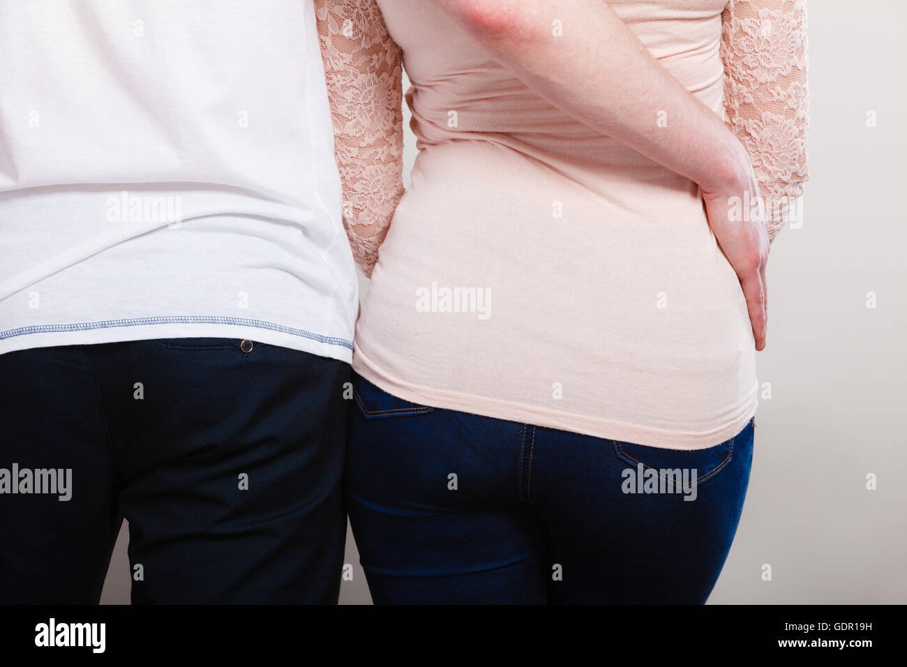 People connected by love. Rear view of girlfriend and boyfriend in hug ...