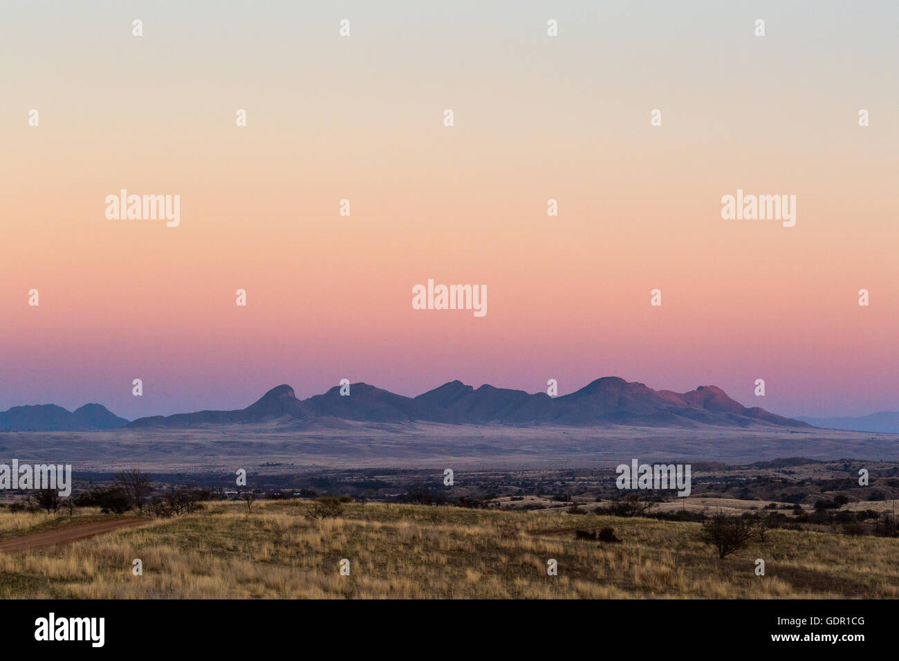 The distant Whetstone Mountains reflecting the last light of day ...