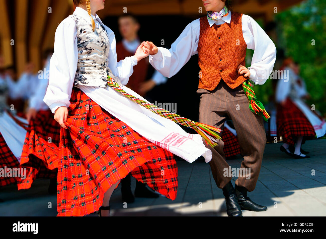 Young people playing lithuanian traditional dances at a local folk ...