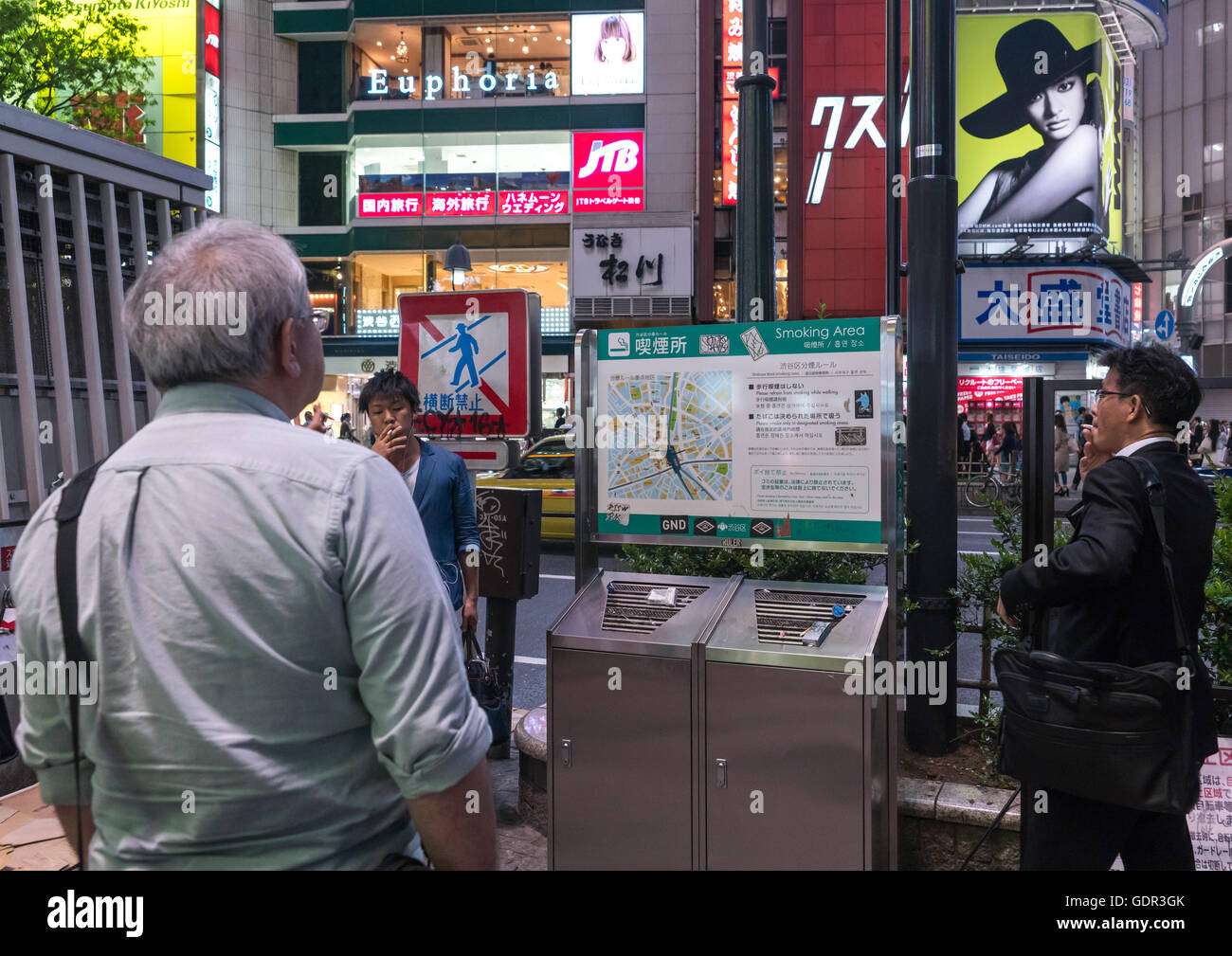 Men in a outdoors public smoking area in shibuya, Kanto region, Tokyo ...