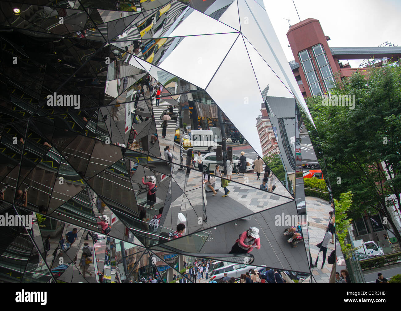 Walking people reflected on glass in tokyu plaza i, Kanto region, Tokyo ...