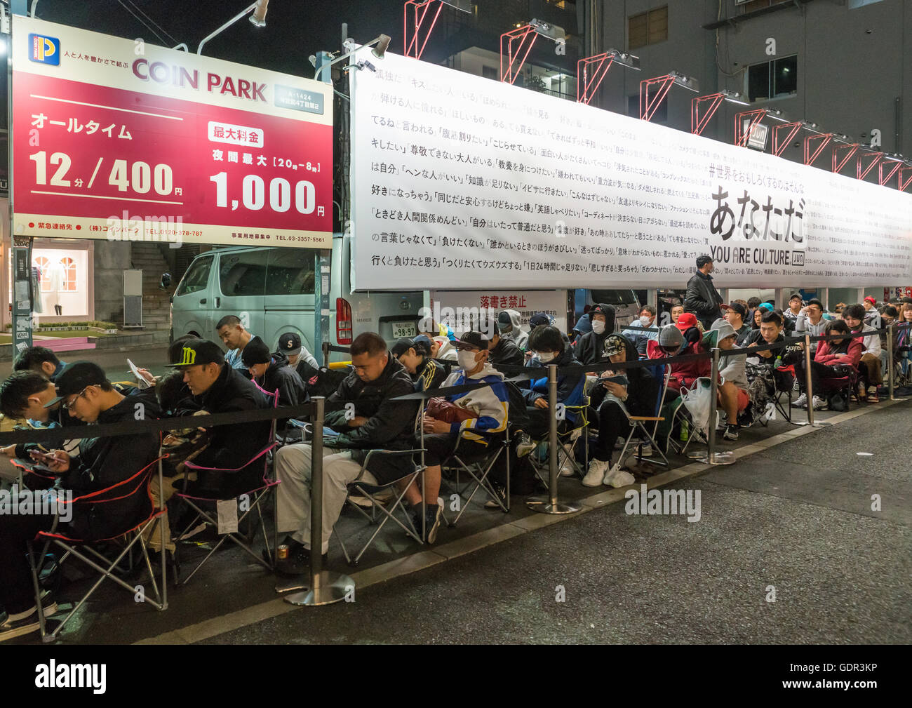 People queueing and sleeping in the street for the opening of a new ...