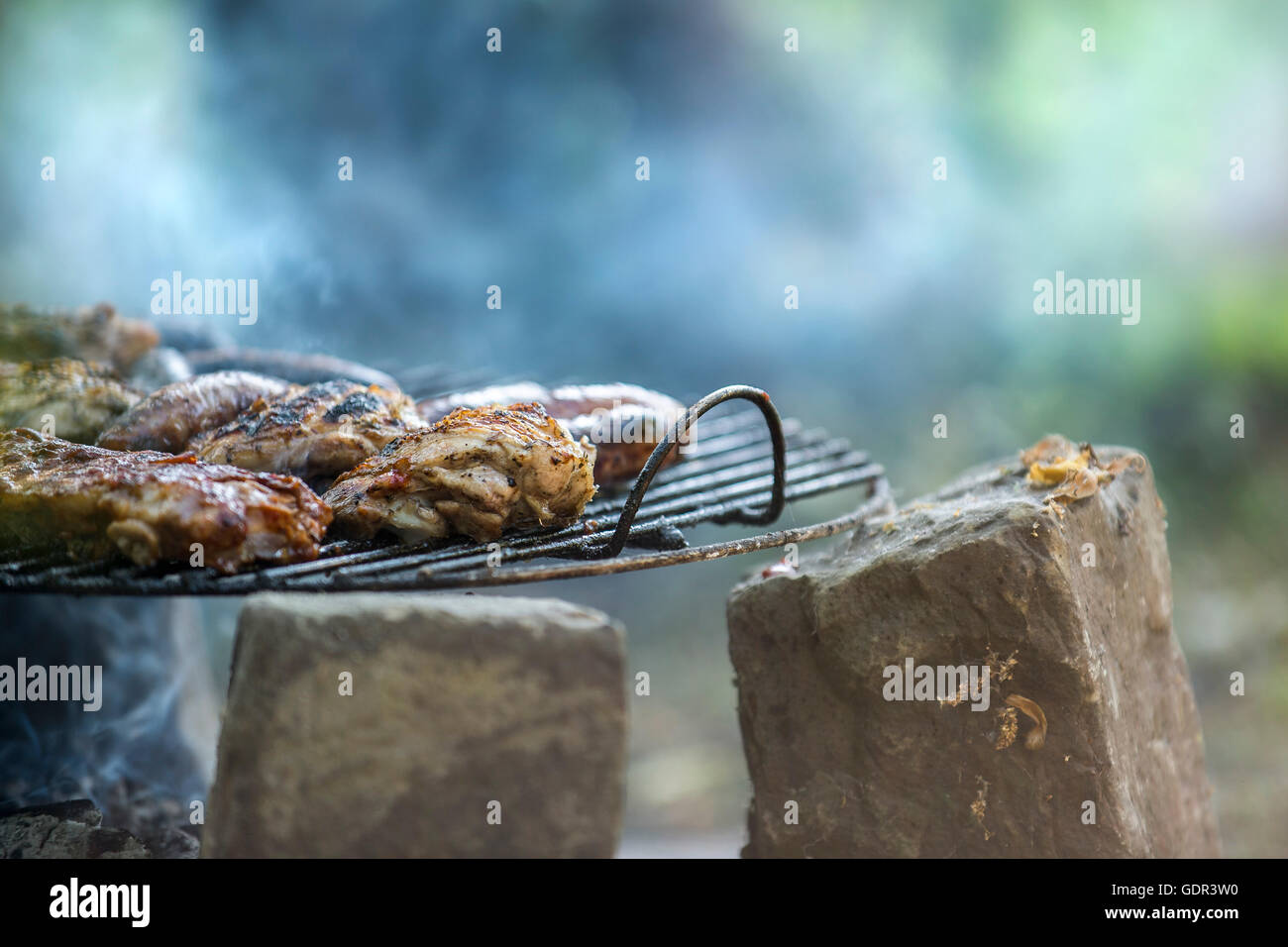 BBQ over a fire Stock Photo - Alamy