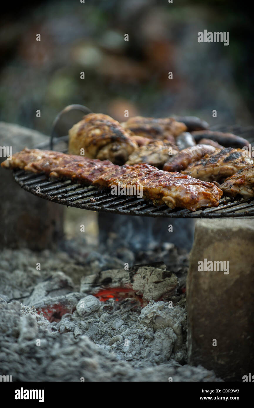 BBQ over a fire Stock Photo - Alamy