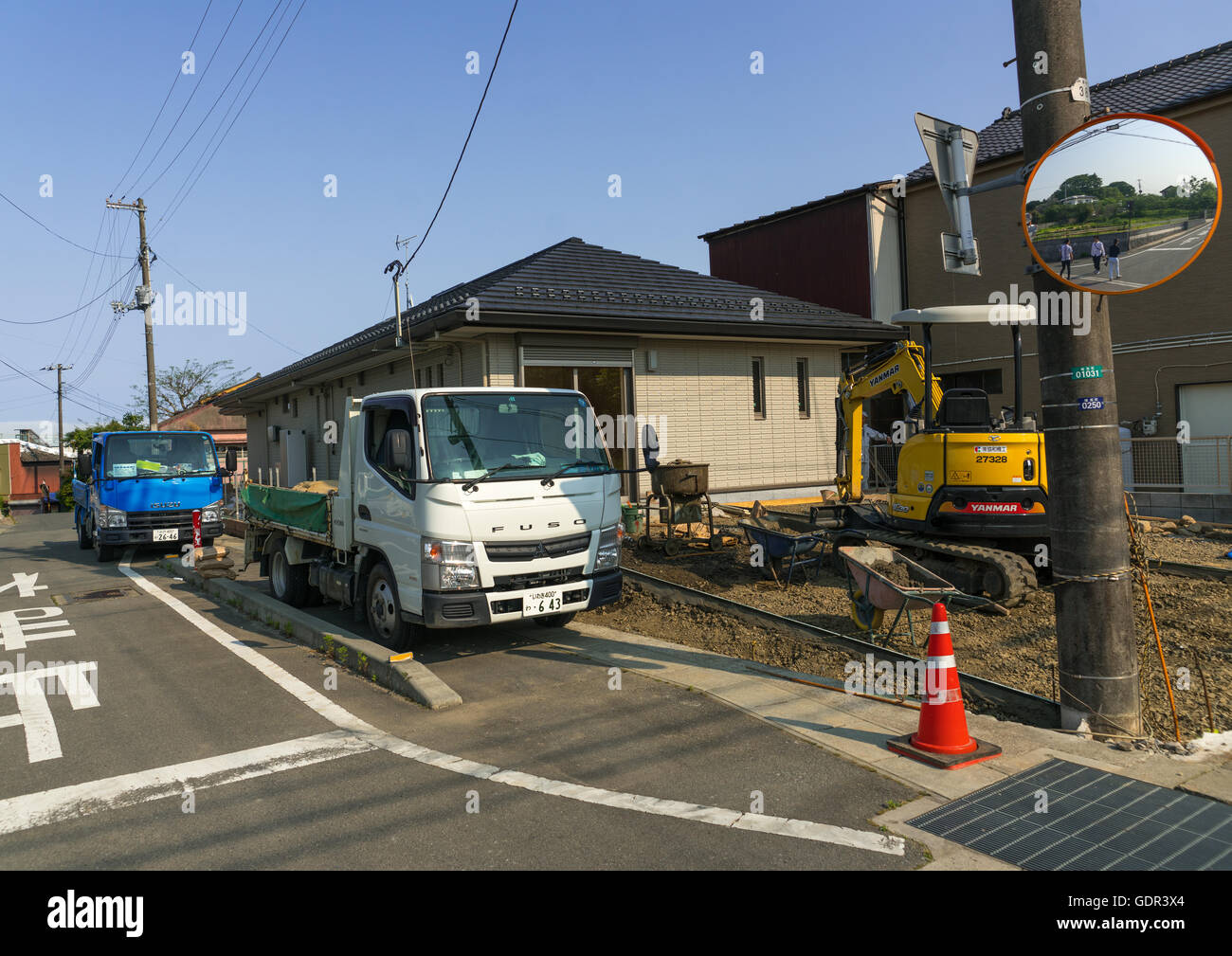 Workers remove top soil contaminated by nuclear radiations of an ...