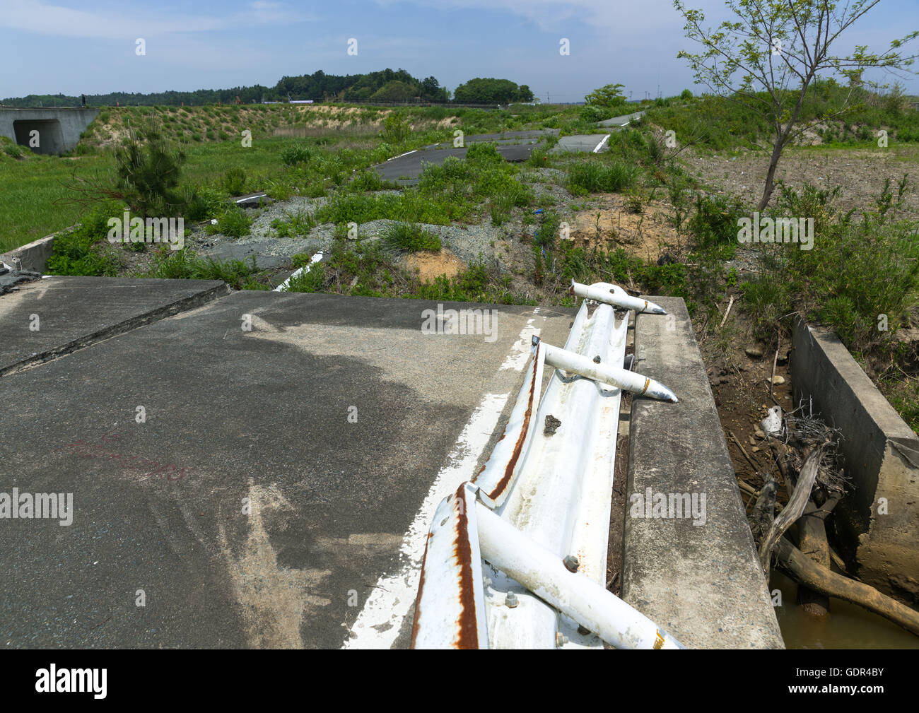 A collapsed road by the 2011 earthquake and tsunami, Fukushima ...