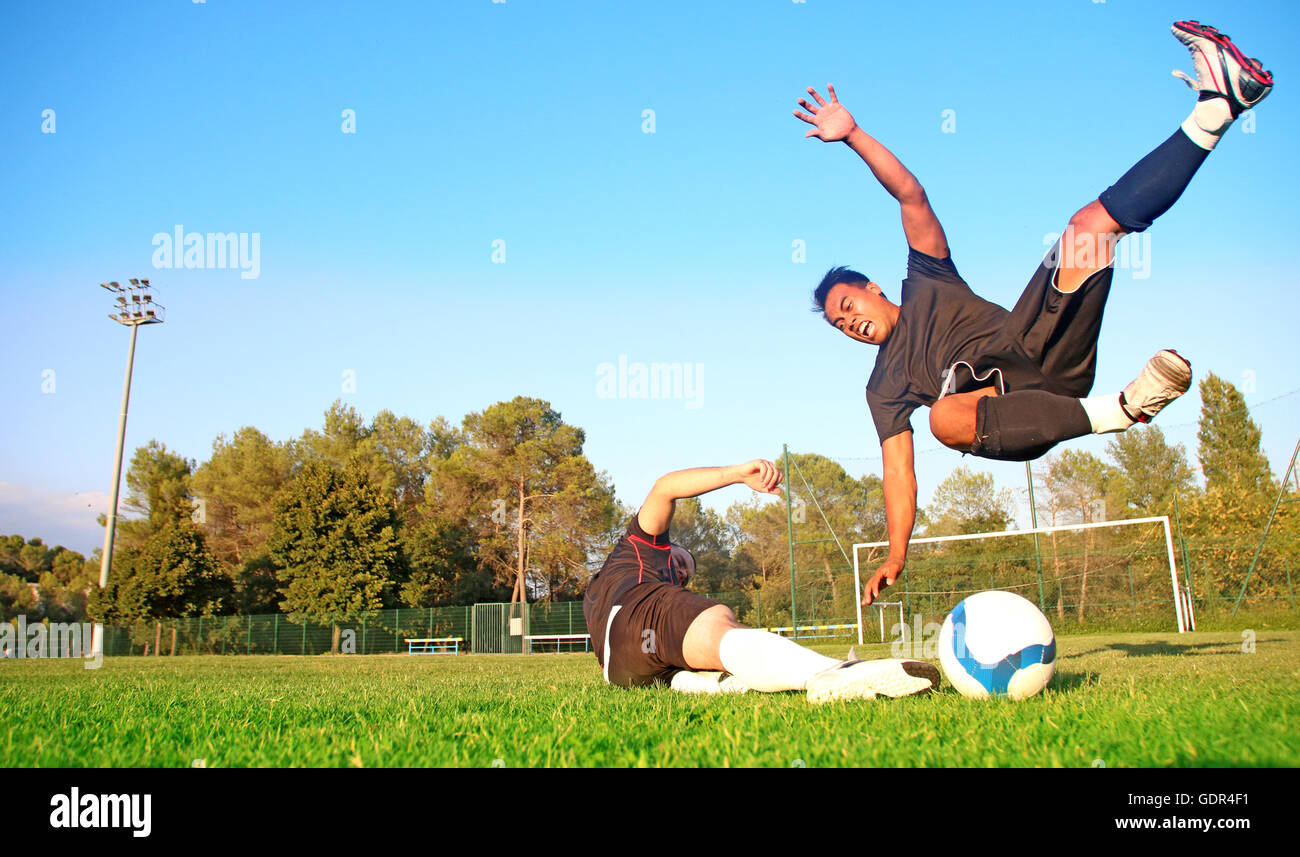 tackle of a soccer player during a match Stock Photo - Alamy