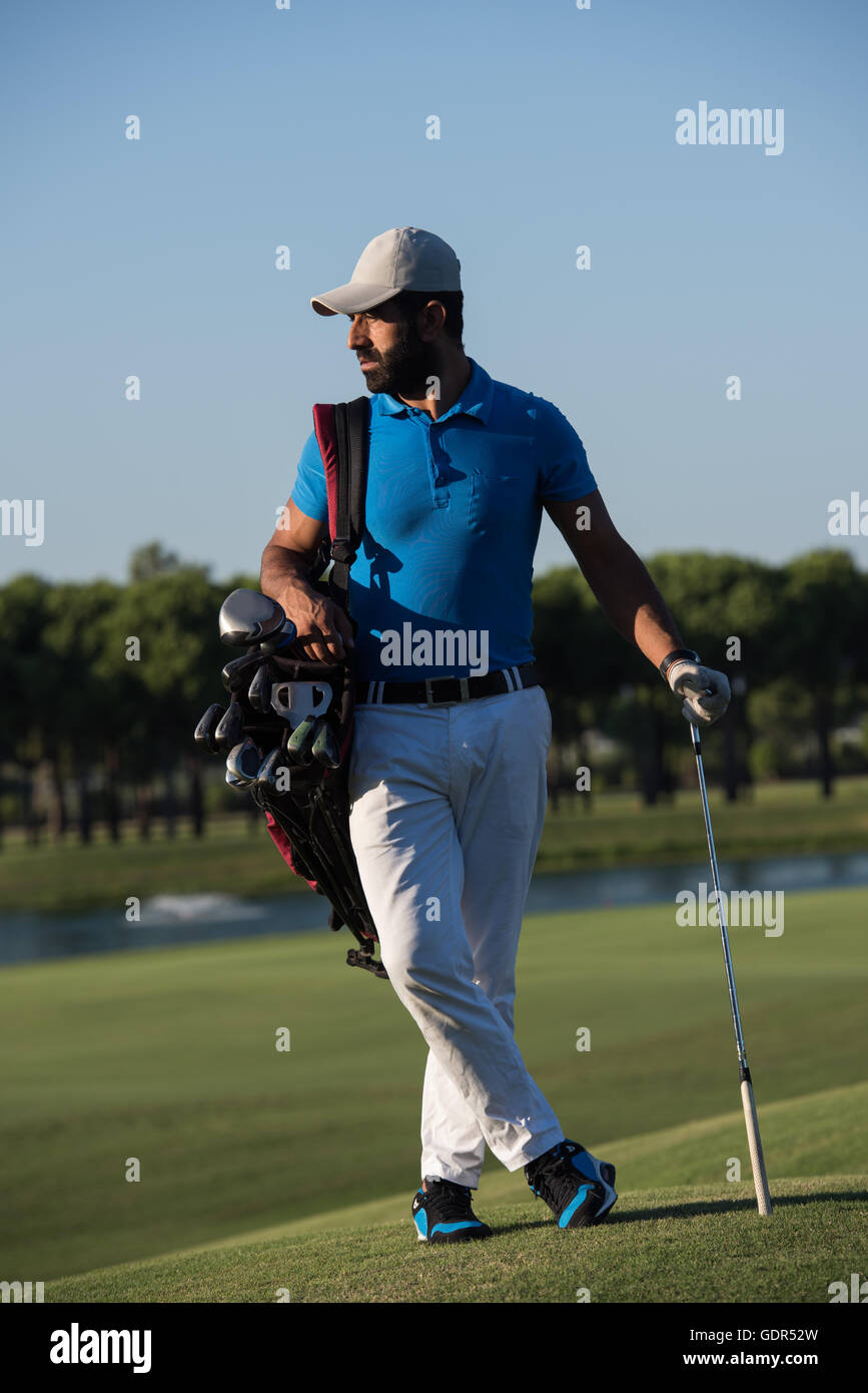 handsome middle eastern golf player portrait at course at sunny day ...