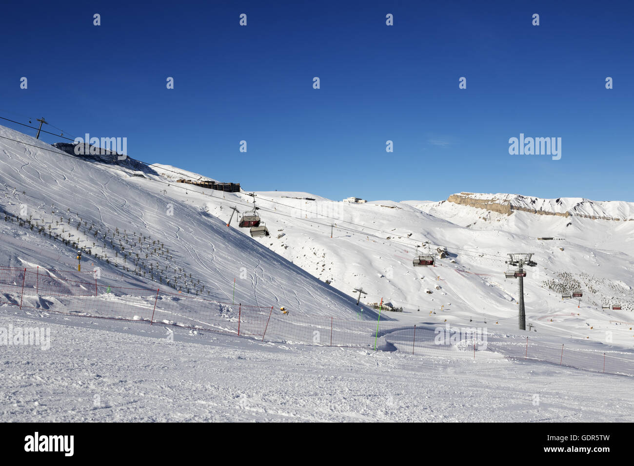 Ski slope and chair-lift at sun day. Greater Caucasus, Mount Shahdagh ...