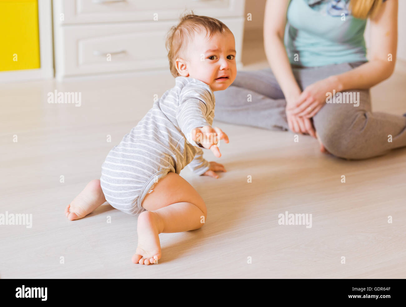 One year old baby crying in bedroom Stock Photo - Alamy