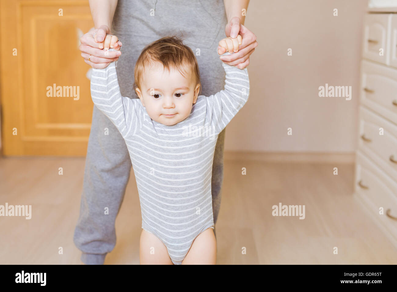 Mother and baby legs. First steps Stock Photo - Alamy
