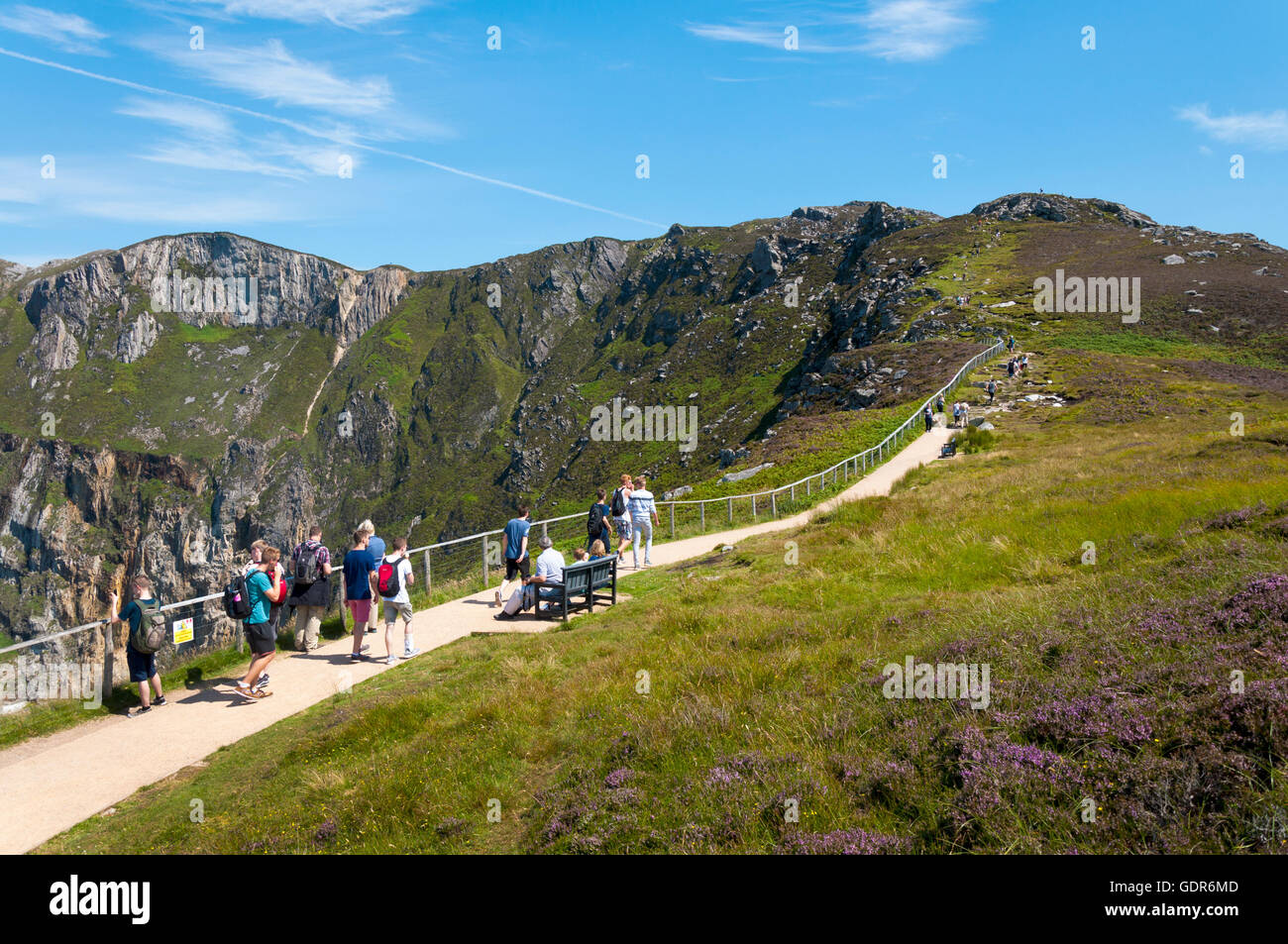 Tourists walk on Slieve League cliffs in County Donegal, Ireland Stock ...