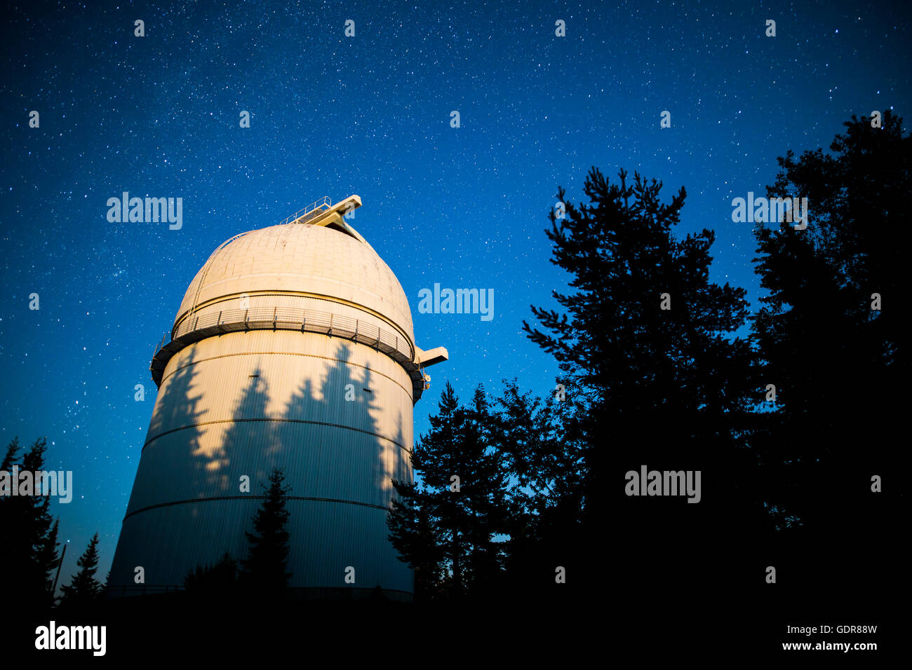 Rozhen astronomical observatory under the night sky stars. Blue sky ...