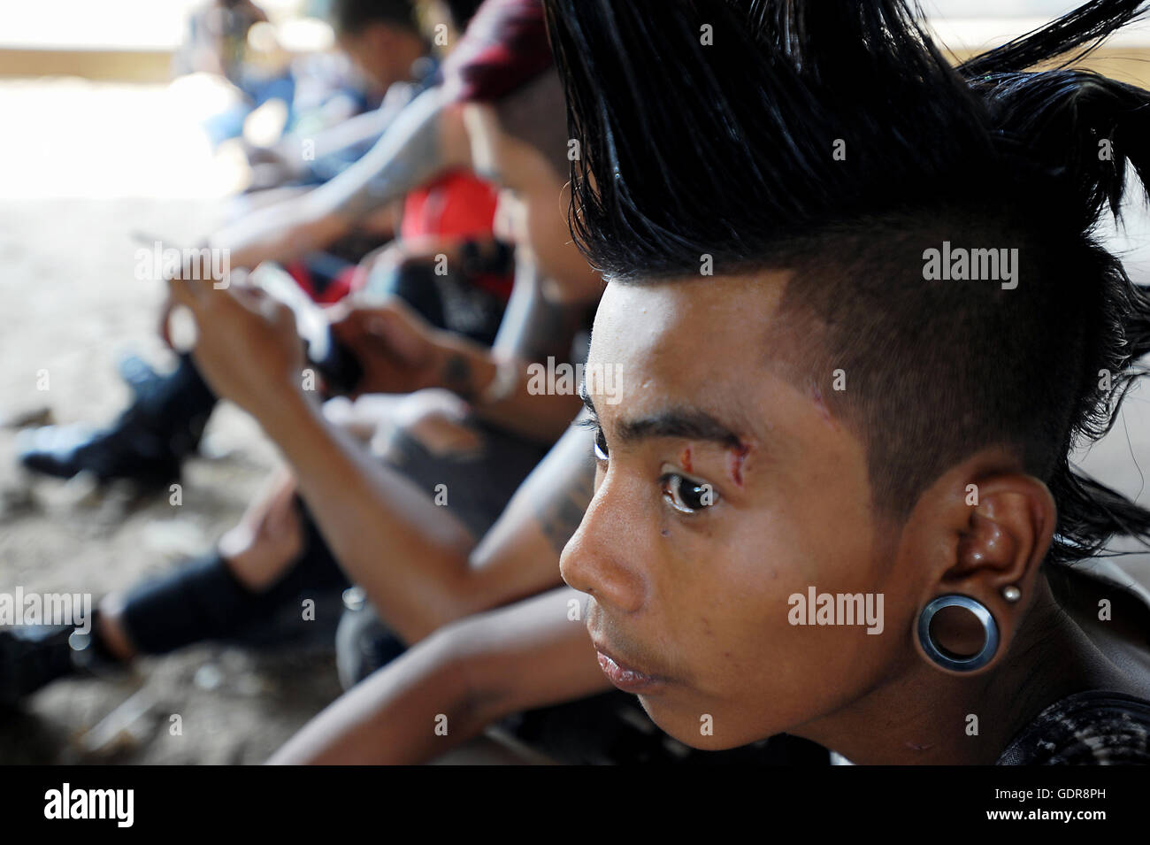 Portrait of a young punk at an underground punk rock concert in the ...