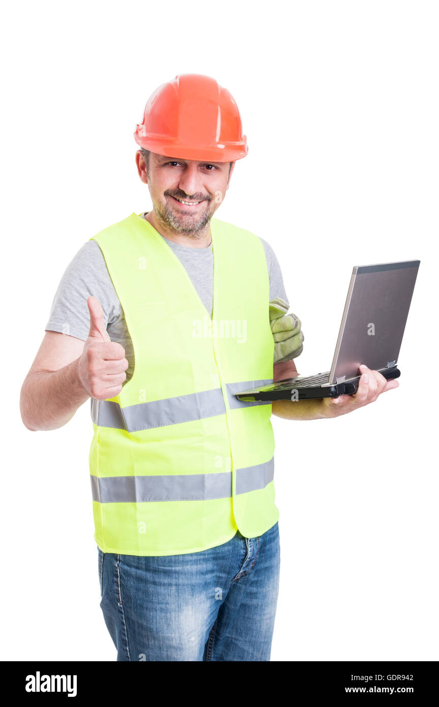 Happy engineer with laptop doing like gesture as successful work ...