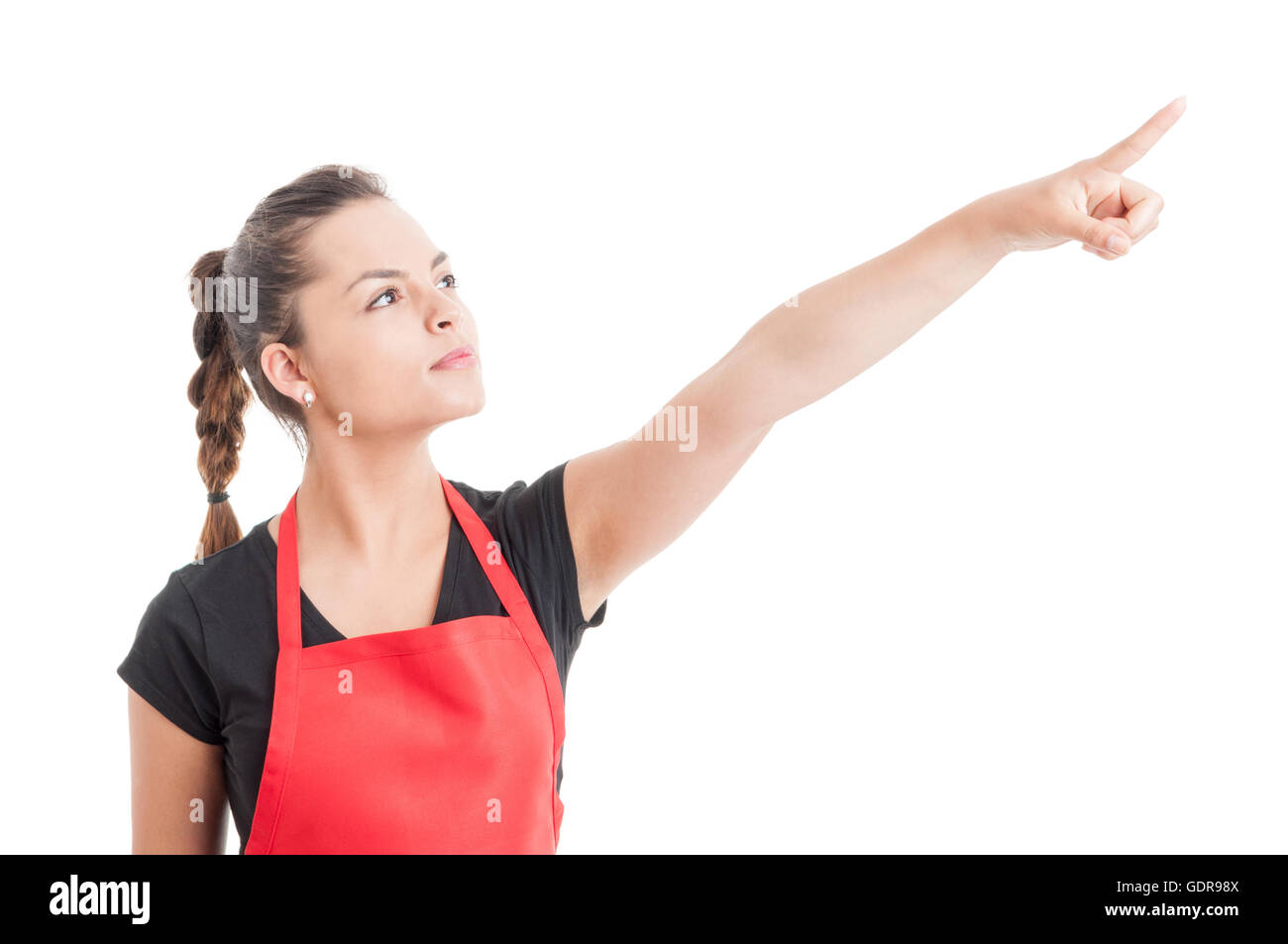 Attractive store employee pointing finger up and showing something ...