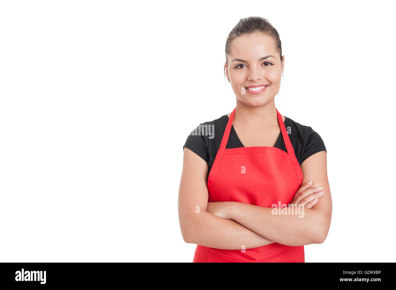 Confident cute employee on supermarket standing with folded arms and ...