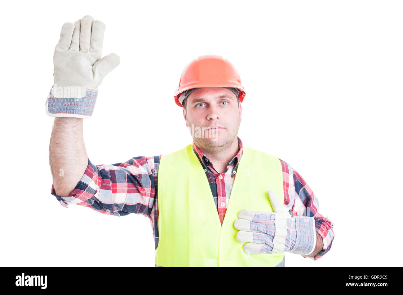 Male builder swearing or making oath as devotion and honesty concept ...