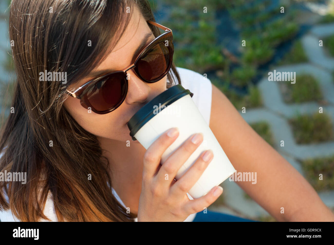 Woman wearing glasses sipping hi-res stock photography and images - Alamy