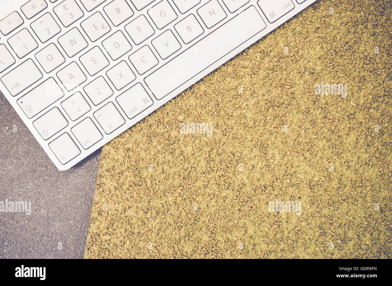 part of computer keyboard on a rough textured surface - copy space ...