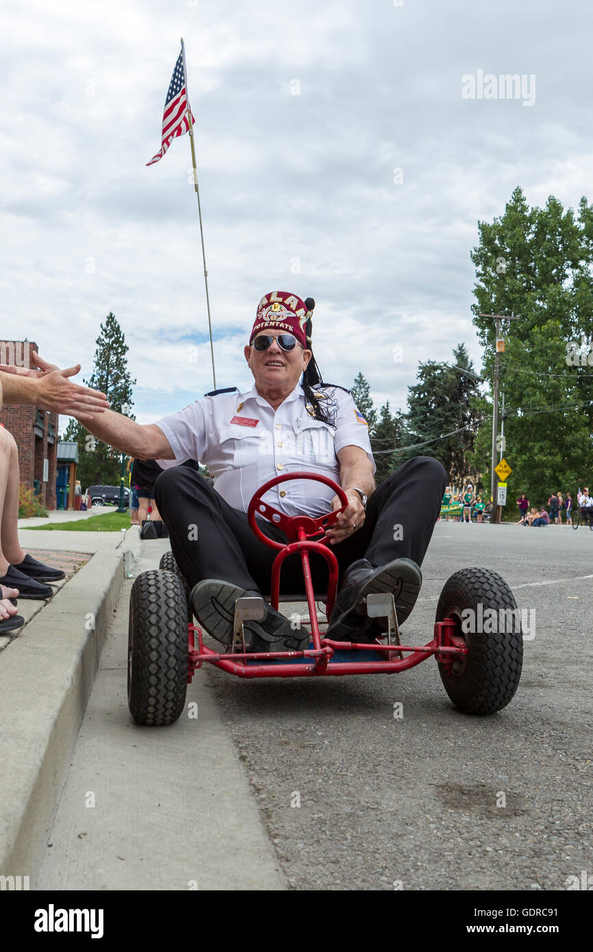Shriner member drives go kart in parade Stock Photo - Alamy