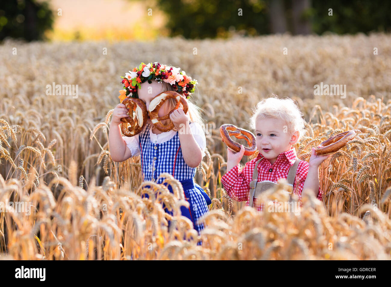 Kids in traditional Bavarian costumes in wheat field. German children ...