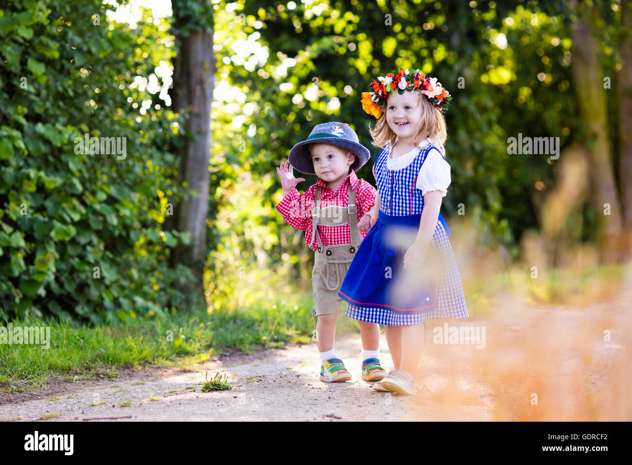 Kids in traditional Bavarian costumes in wheat field. German children ...