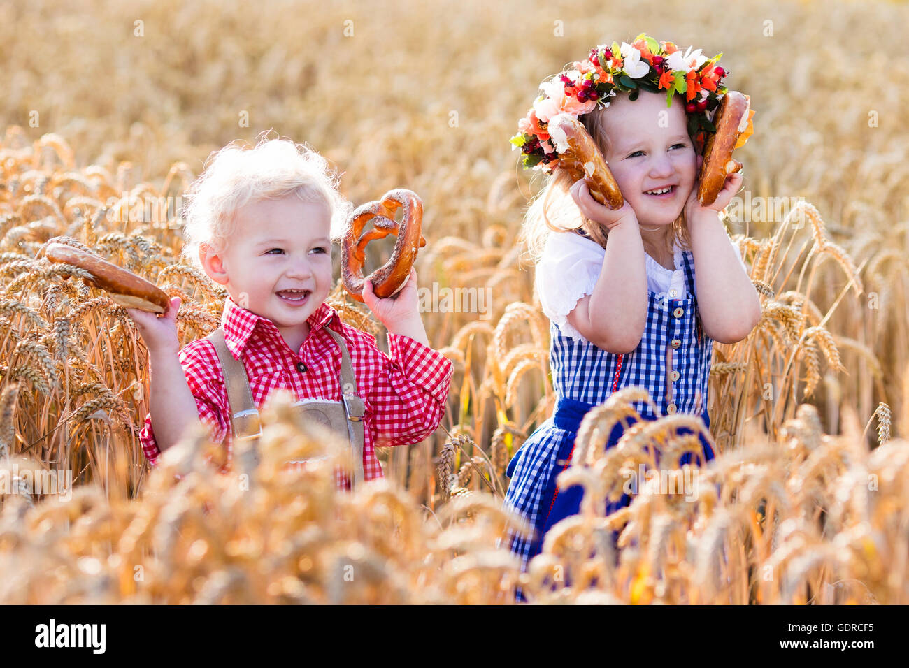 Kids in traditional Bavarian costumes in wheat field. German children ...