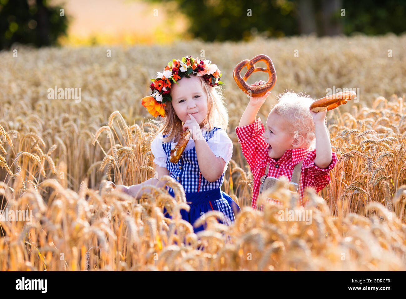 Kids in traditional Bavarian costumes in wheat field. German children ...