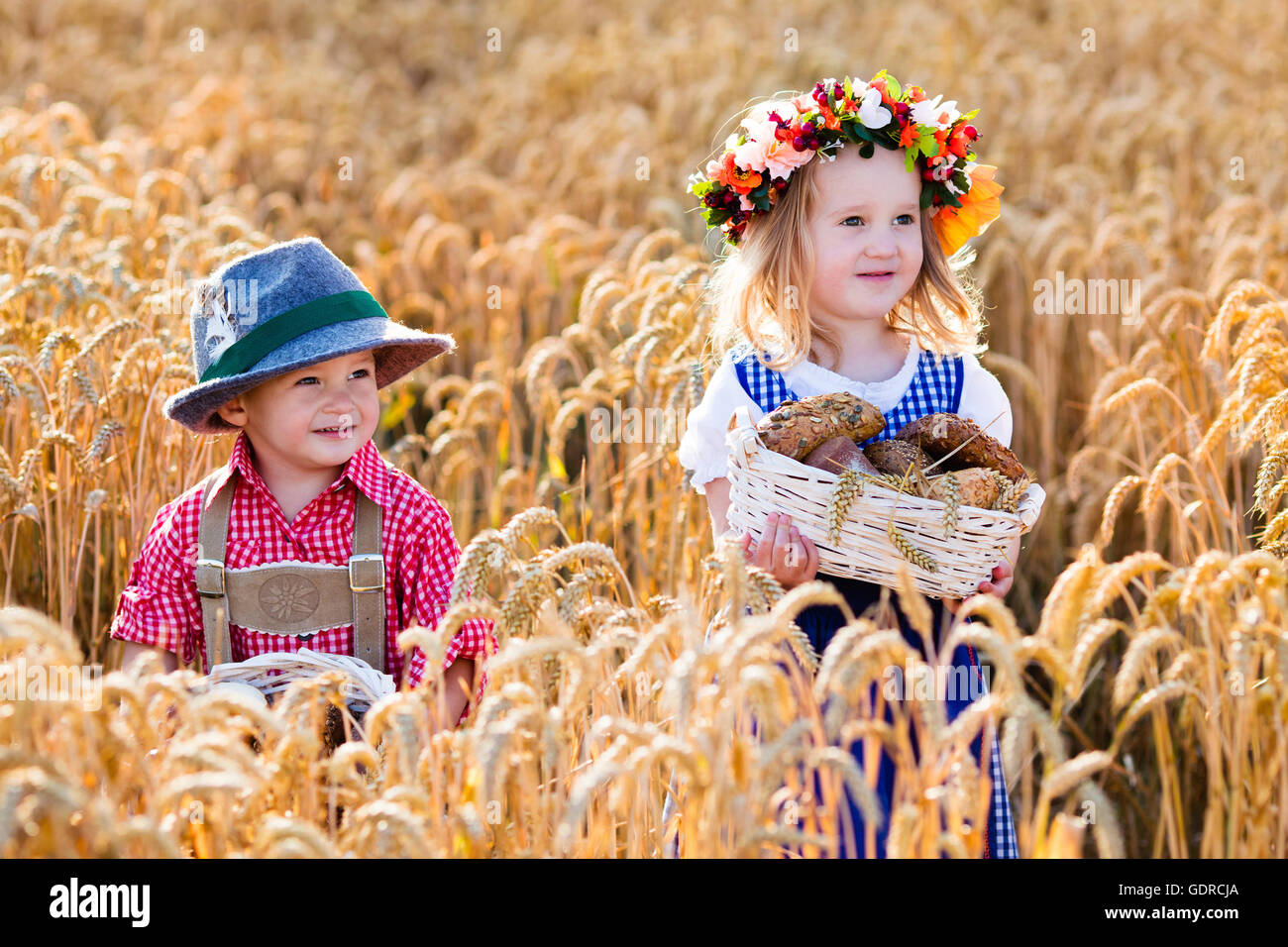 Kids in traditional Bavarian costumes in wheat field. German children ...