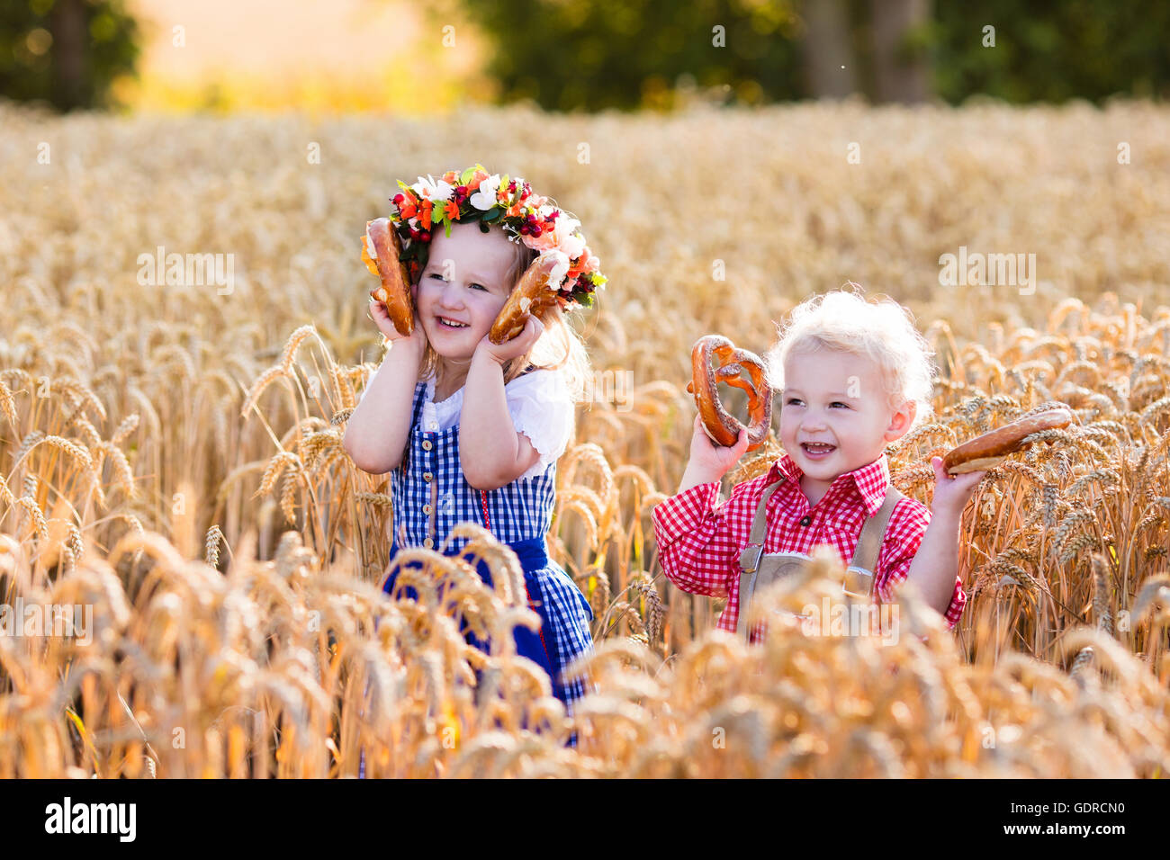 Kids in traditional Bavarian costumes in wheat field. German children ...