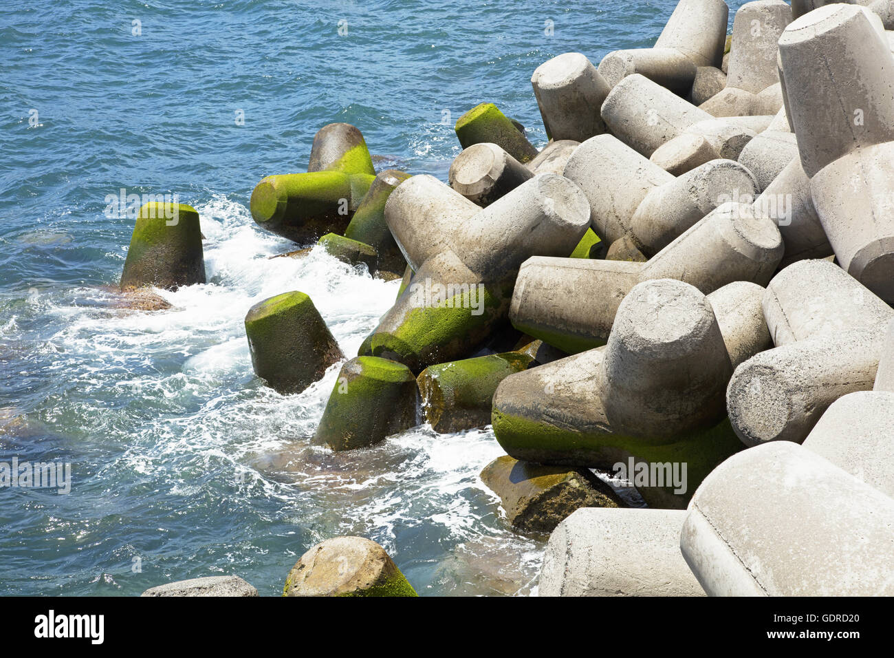 concrete tetrapods form a breakwater Stock Photo - Alamy