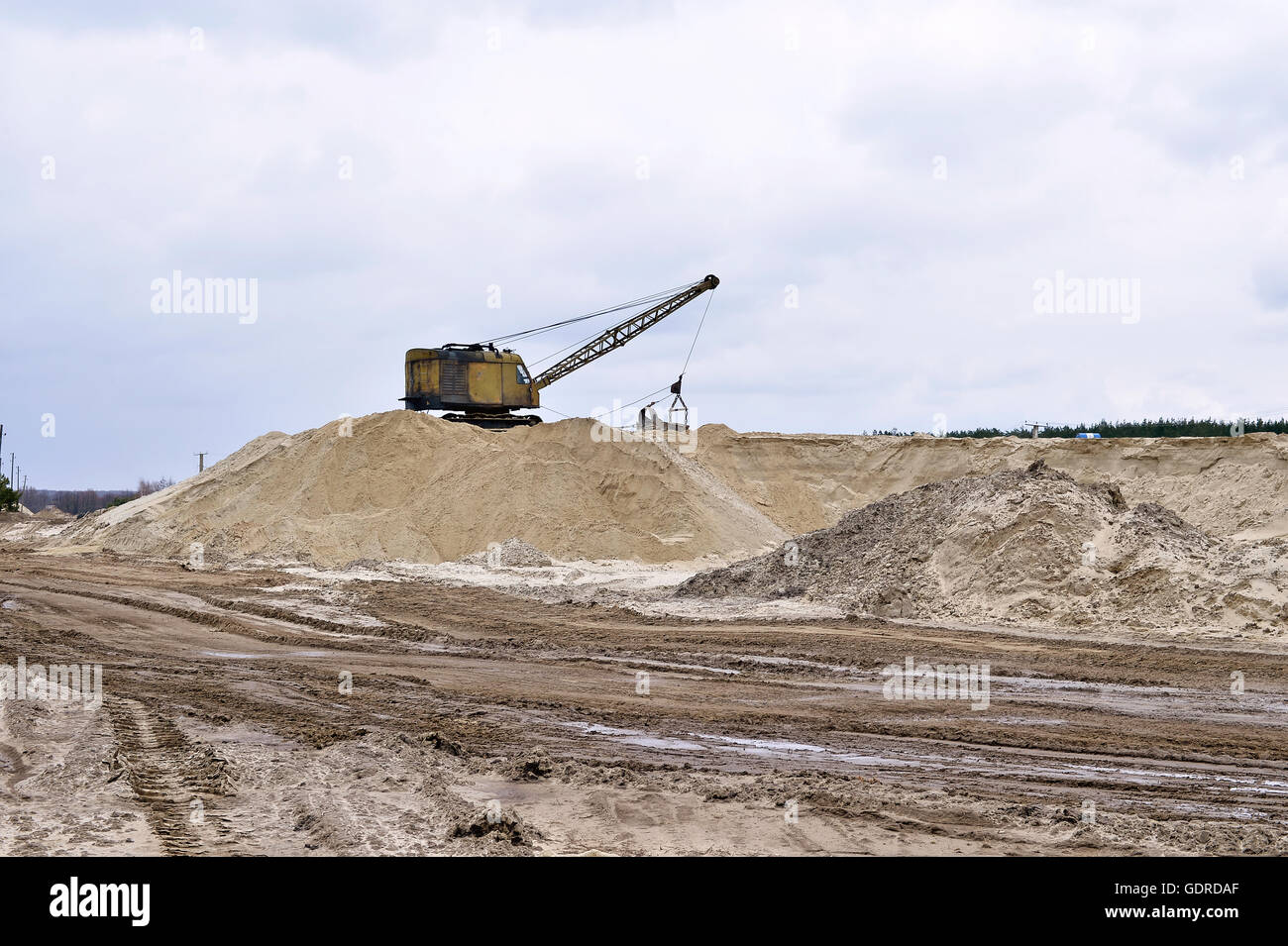 Working digger in a quarry produces sand Stock Photo - Alamy Working digger in a quarry produces sand Stock Photo - Alamy