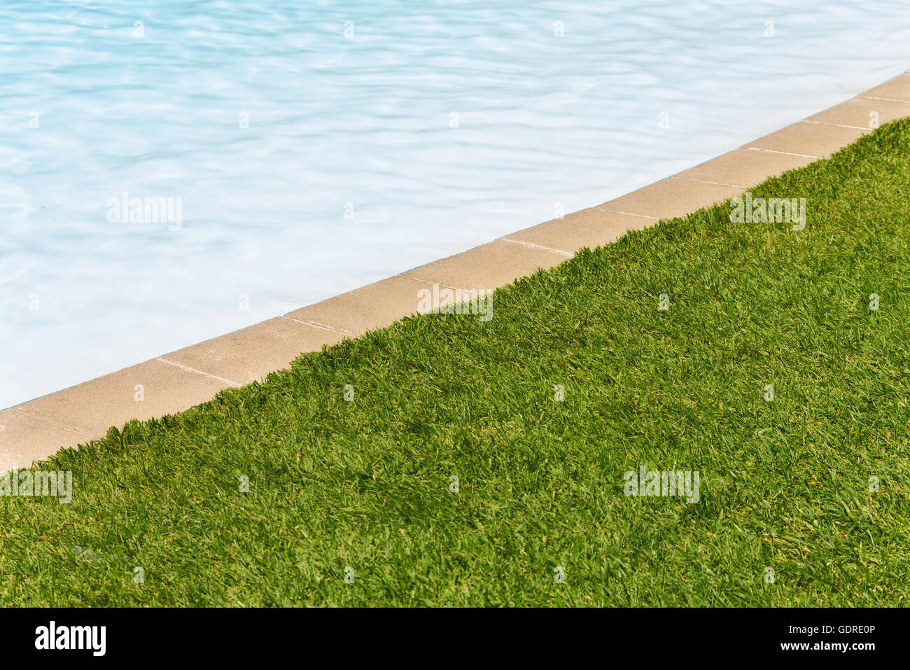 Clear and natural Grass edge swimming pool background with half and ...