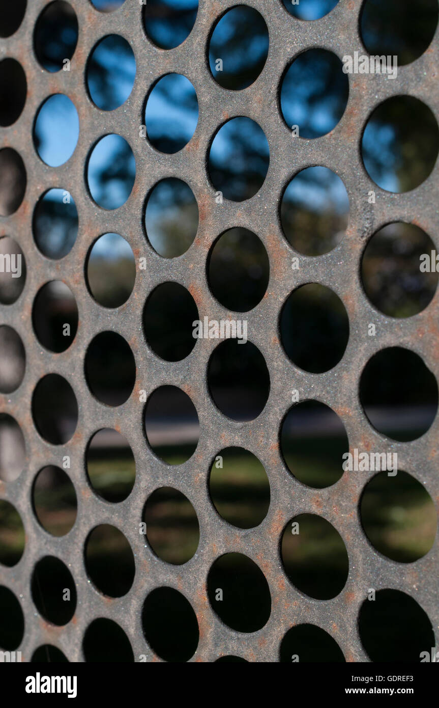 Metallic fence with a circular pattern Stock Photo - Alamy