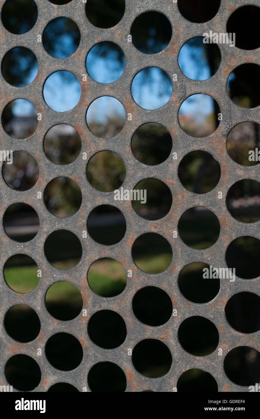 Metallic fence with a circular pattern Stock Photo - Alamy