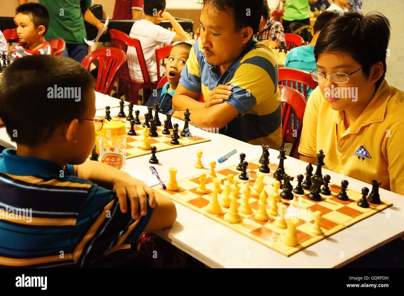 Group of Asian children in chess compete, Vietnamese kid think with ...