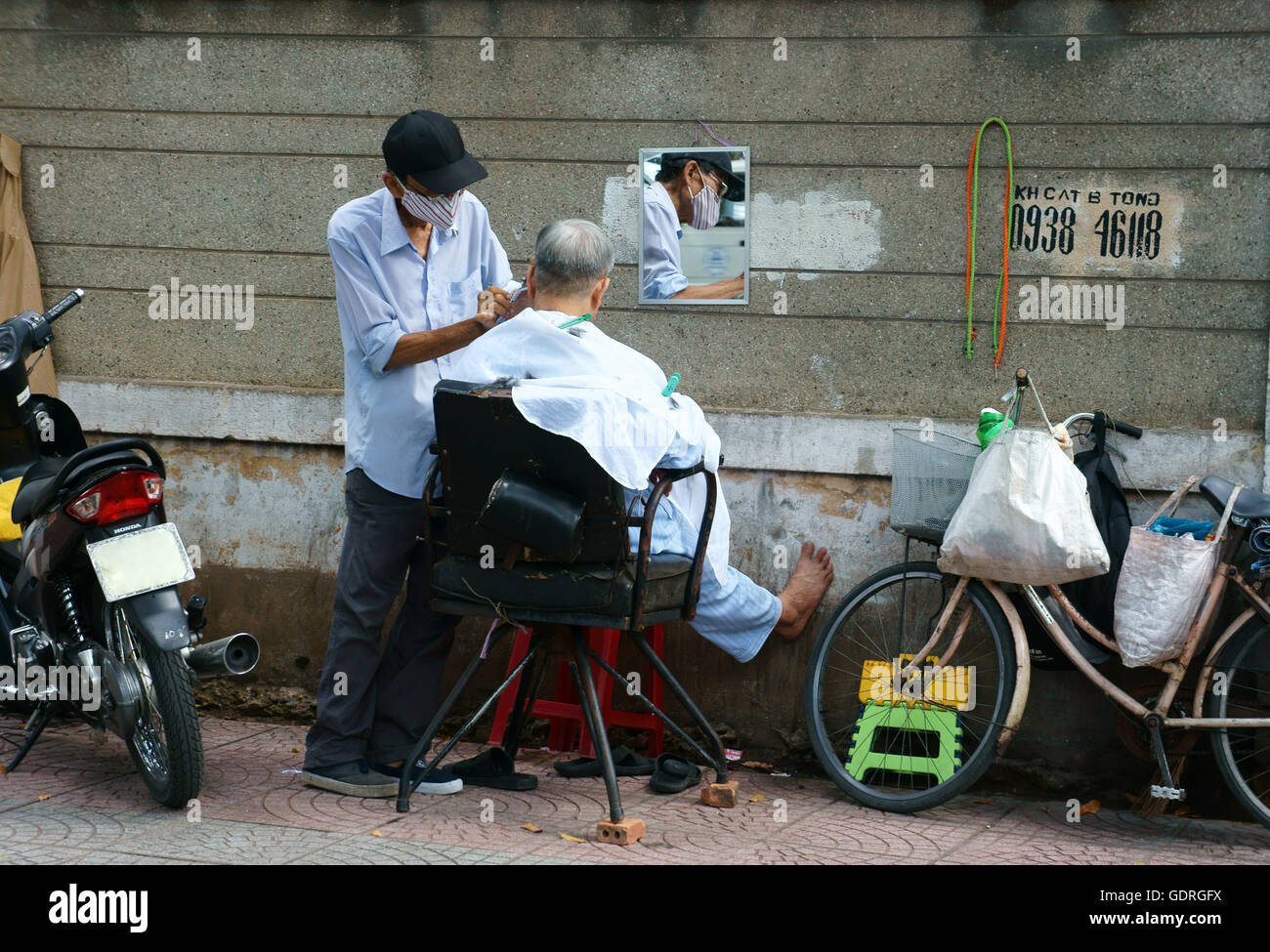 Traditional lifestyle of poor people in Asia urban, Vietnamese male ...