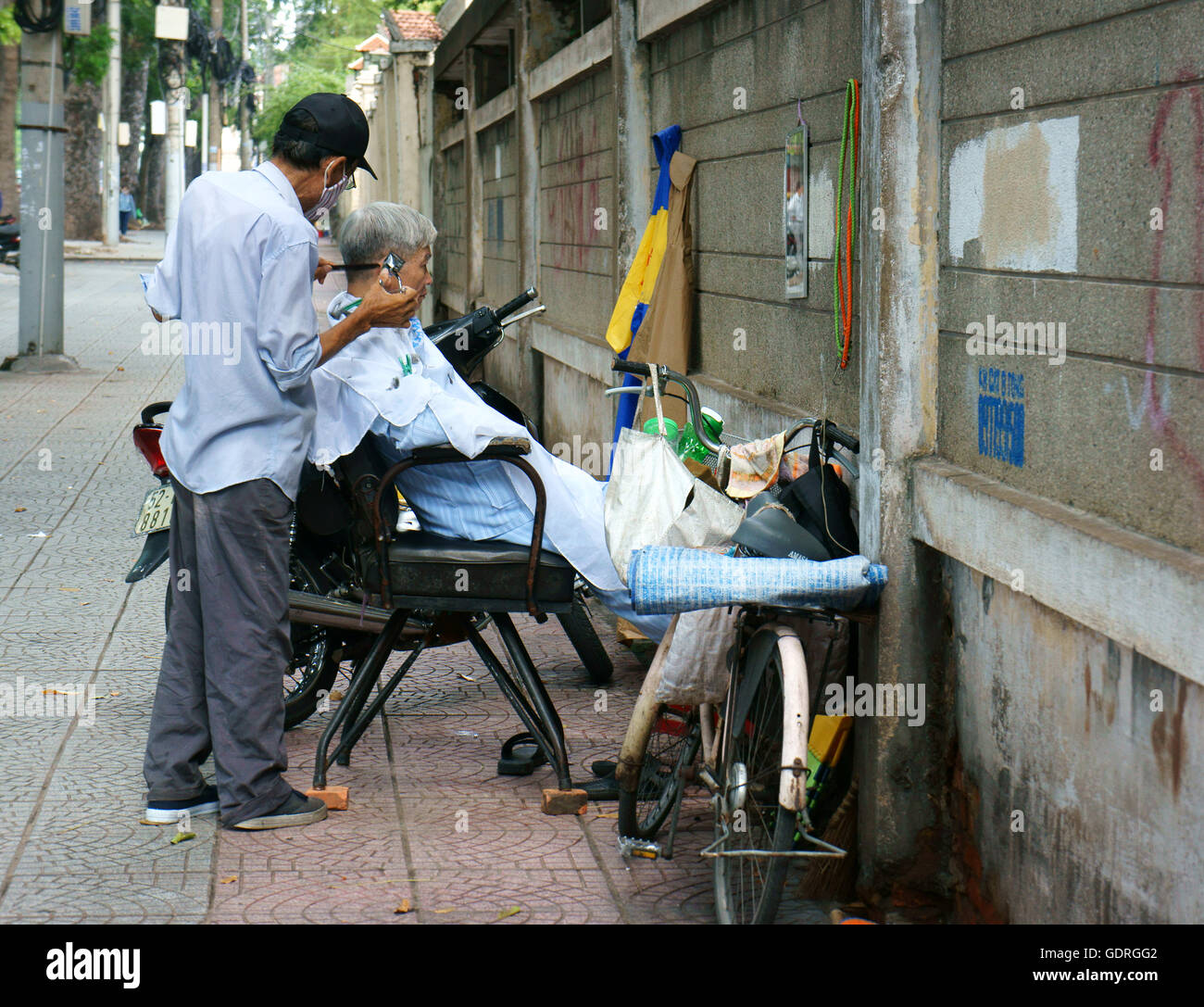 Traditional lifestyle of poor people in Asia urban, Vietnamese male ...
