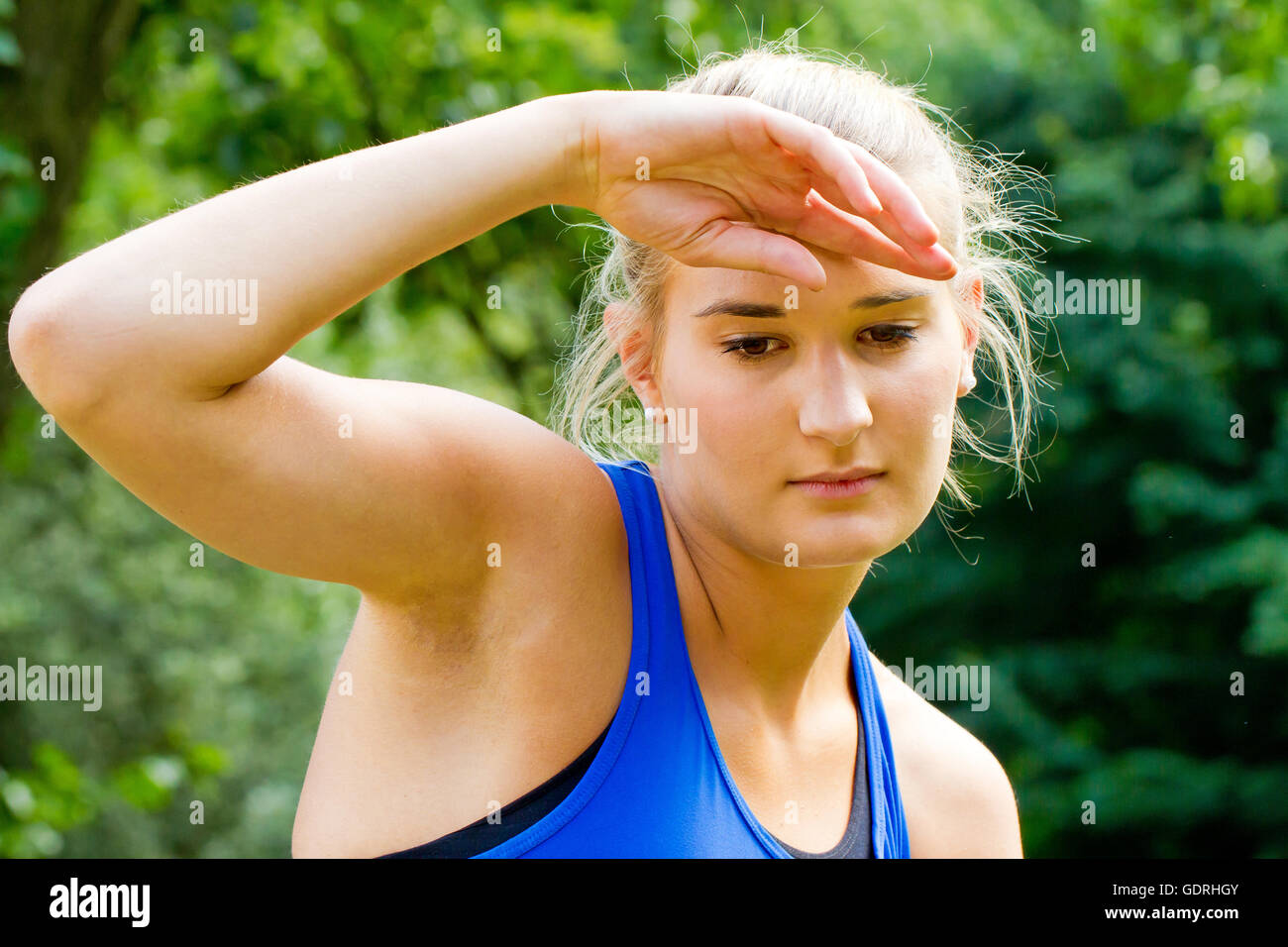 Young exhausted woman after sport Stock Photo - Alamy