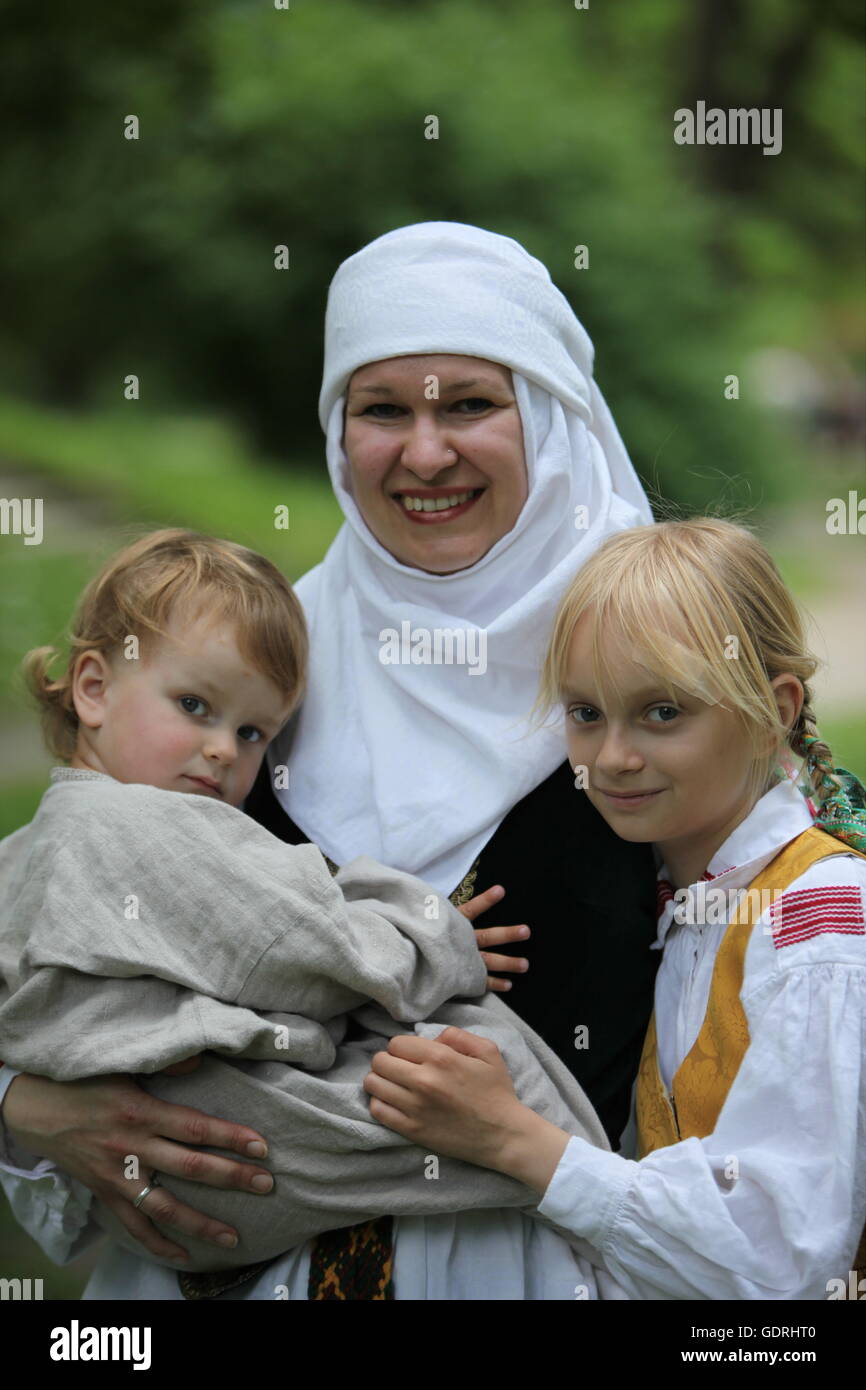 a Women in traditional dress on a Summer Festival in a Parc in the old ...